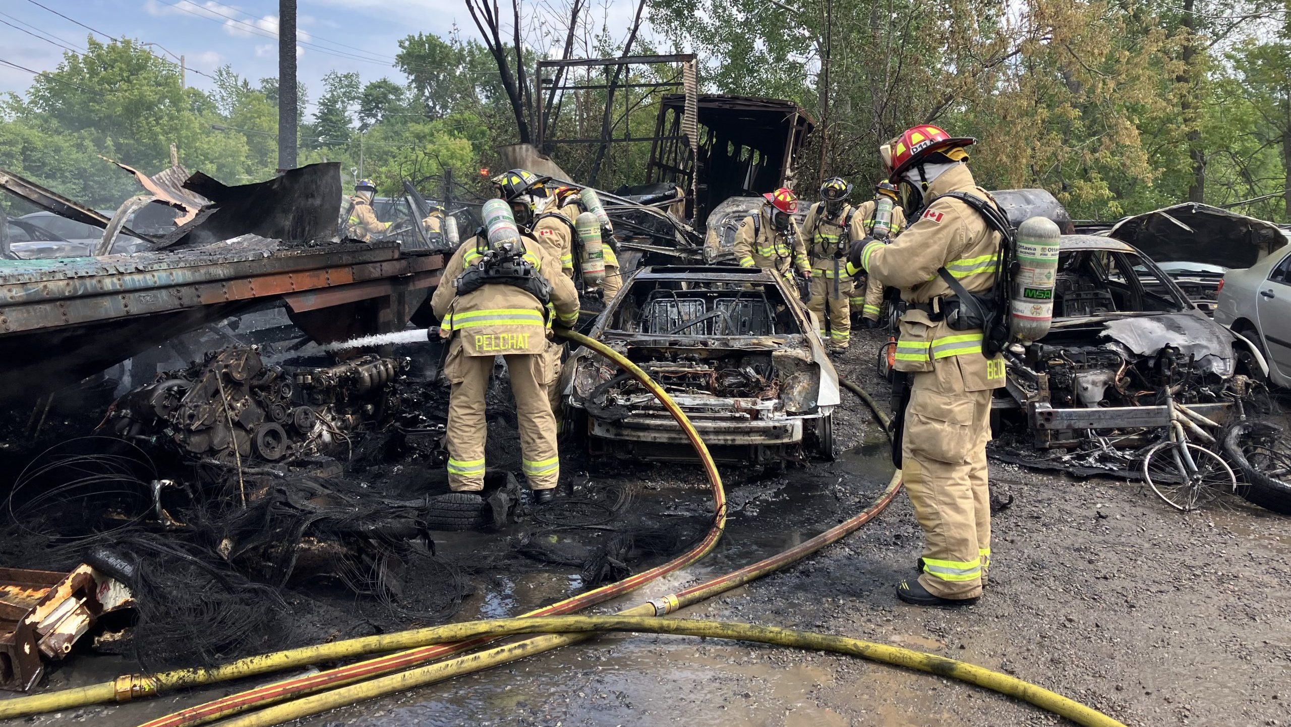 Multiple vehicles and trailer containing tires catch fire forcing thick ...