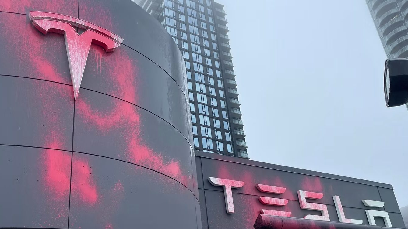 Climate organization spray paints Tesla dealership in protest of Elon Musk