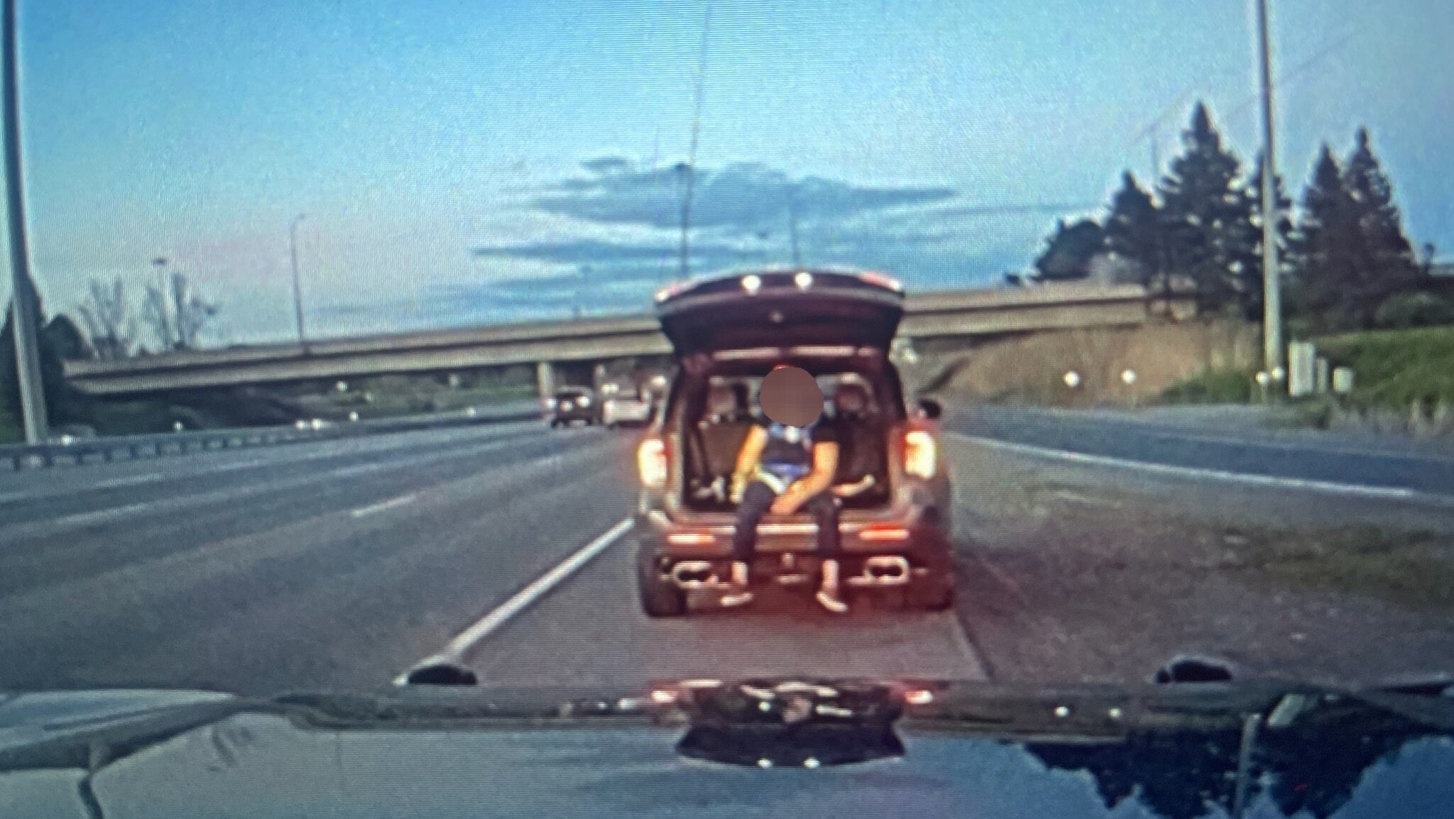 Person caught riding in SUV trunk filming sports cars on Hwy. 417