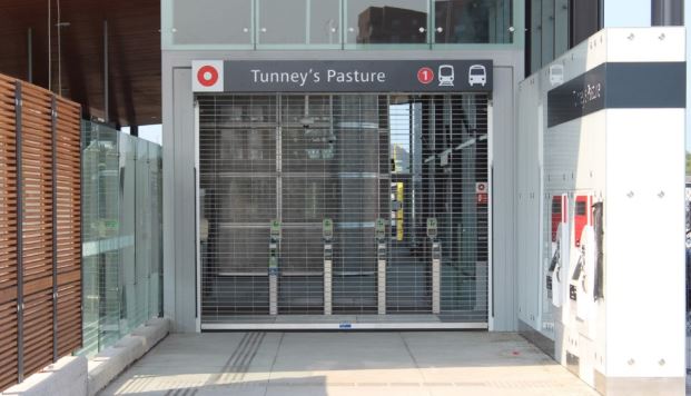 Emergency crews free man trapped under bus at Tunney's Pasture station